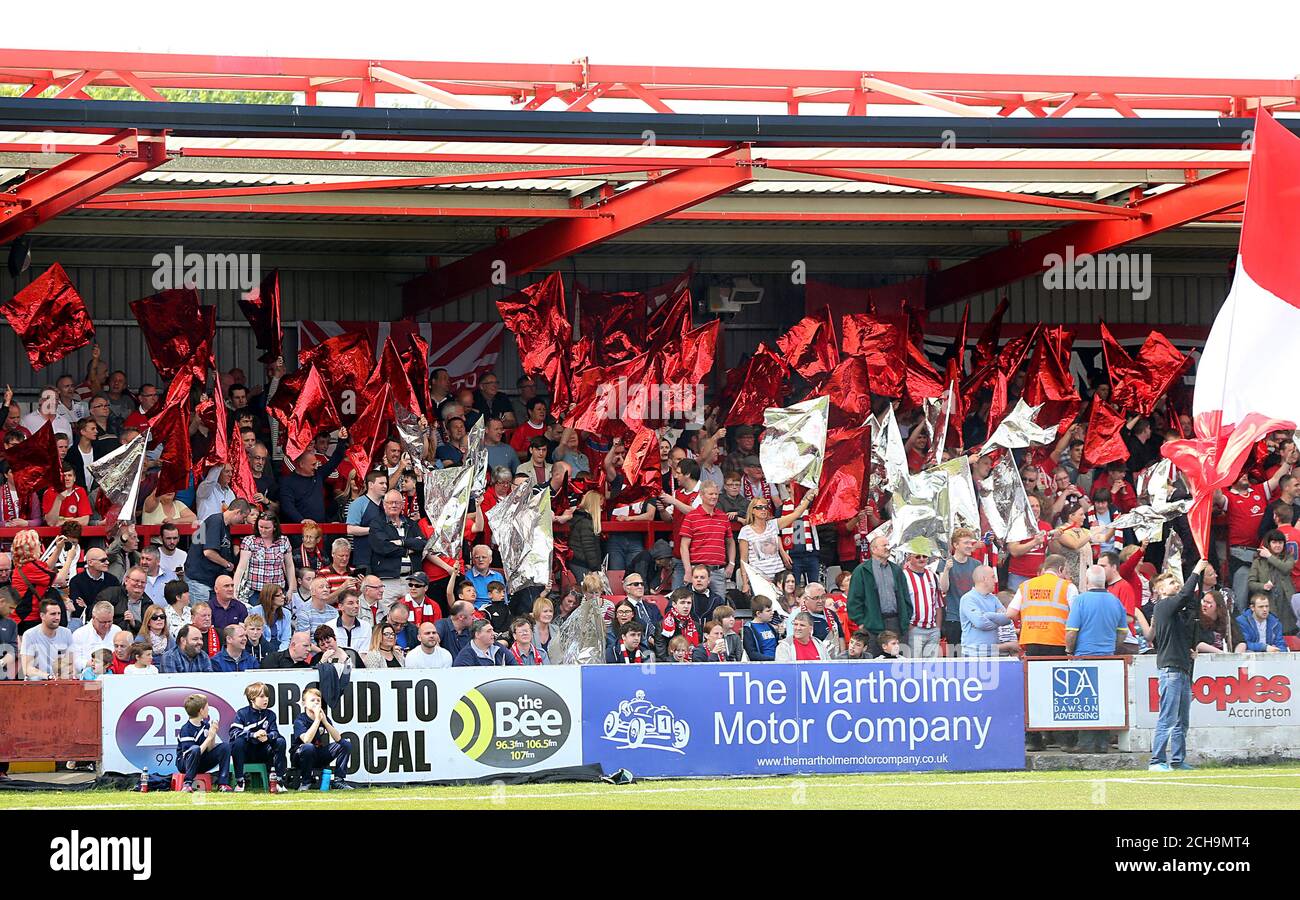 Fans waving flags in the stands Stock Photo - Alamy