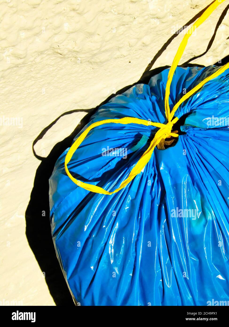 Blue plastic garbage bag hi-res stock photography and images - Alamy