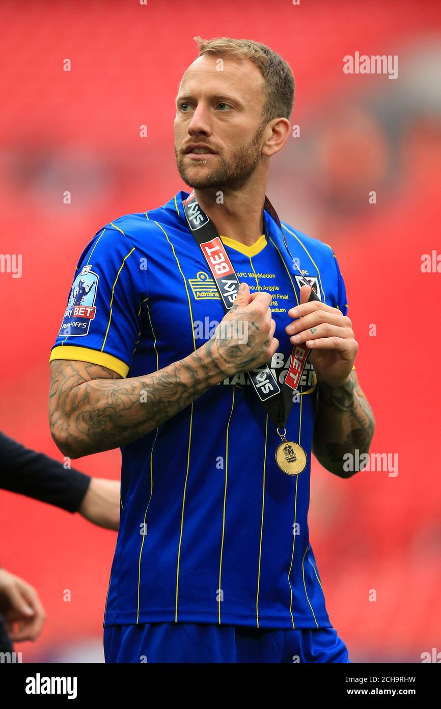 AFC Wimbledon's Sean Rigg celebrates with his medal Stock Photo - Alamy
