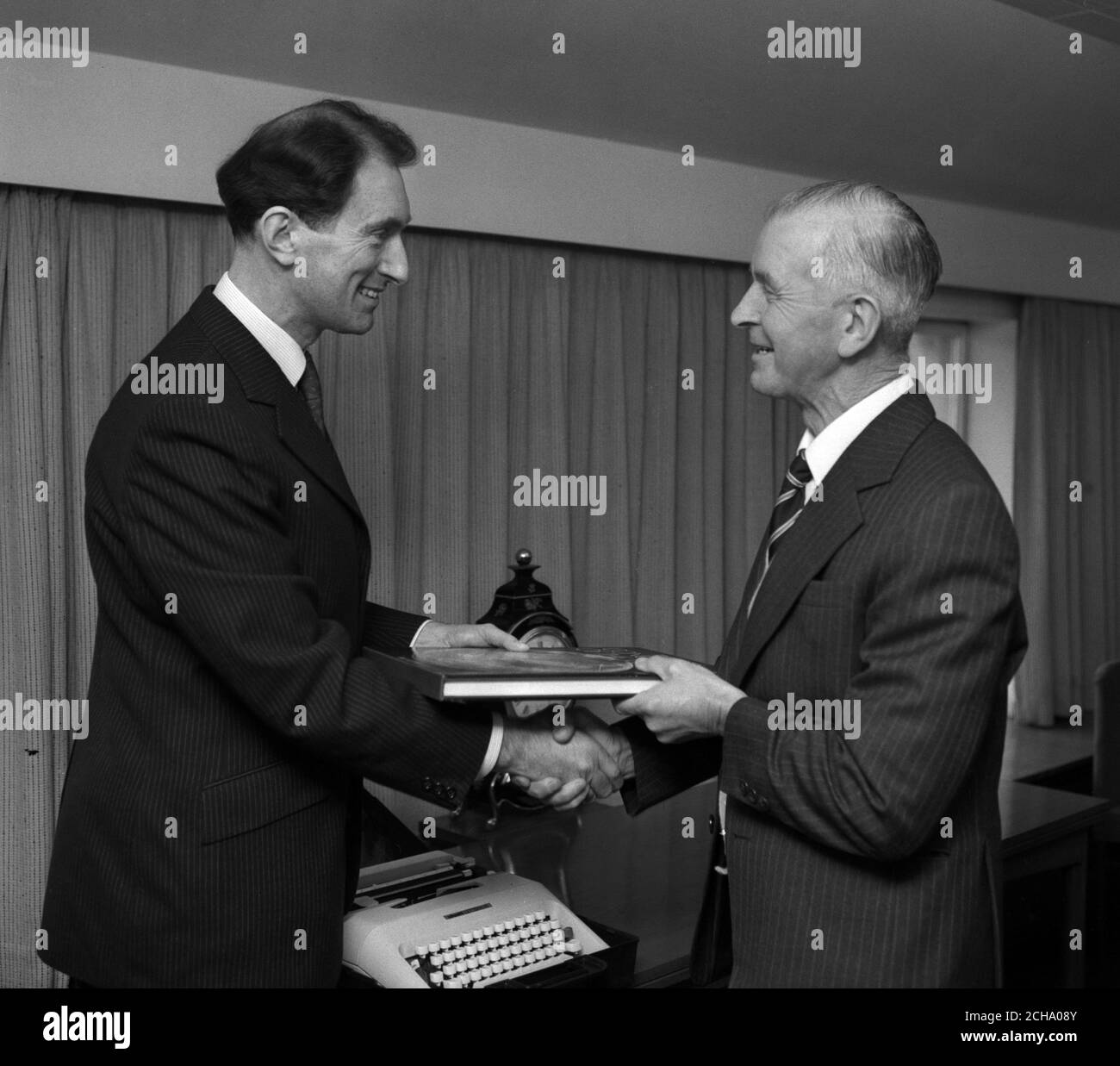 J.F. Blane (r) is presented with his Long Service Award by Ian Yates ...