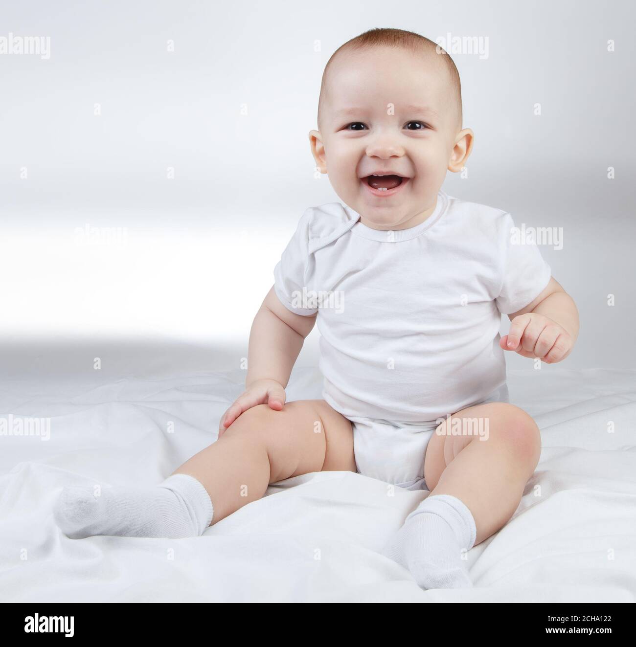 Photo of a ten-month-old smiling baby on a white background Stock Photo ...