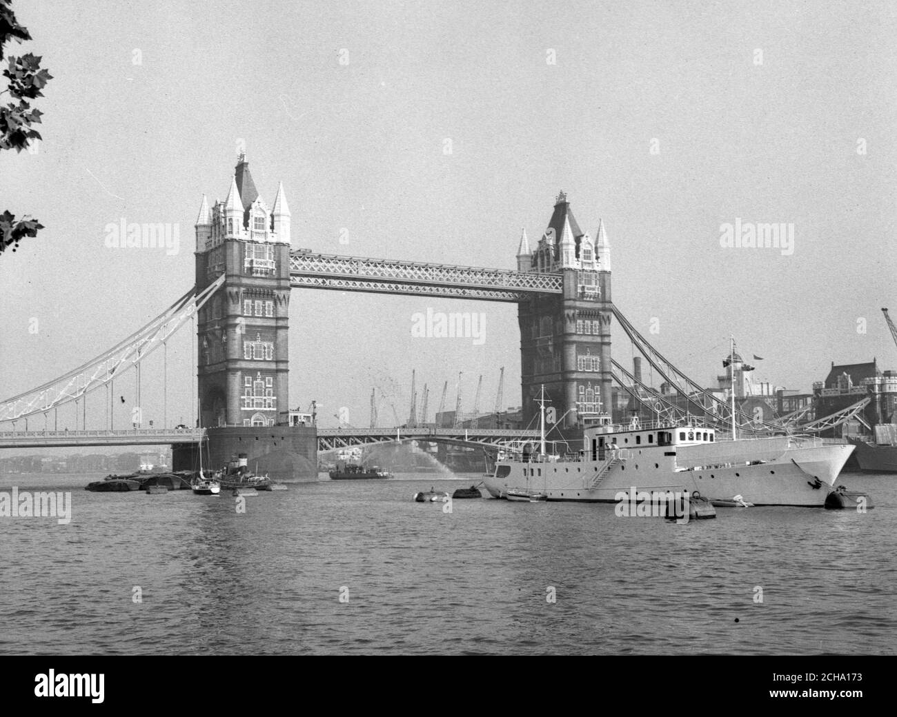 A River Thames fireboat of the London Fire Brigade tend to a fire ...