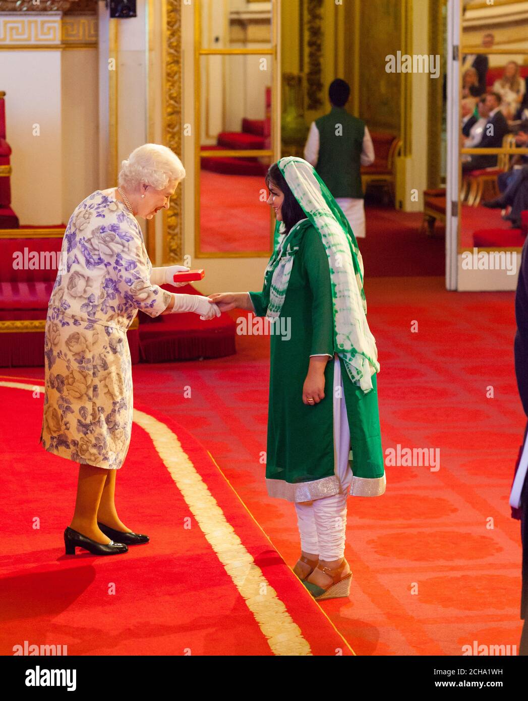 Ms. Zainab Bibi from Pakistan receives a medal from Queen Elizabeth II ...