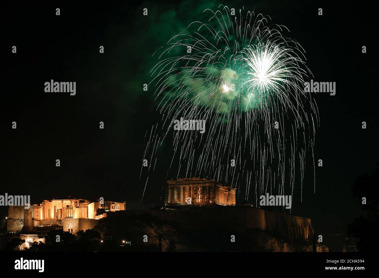 Fireworks explode over the ancient parthenon temple at the acropolis hi ...