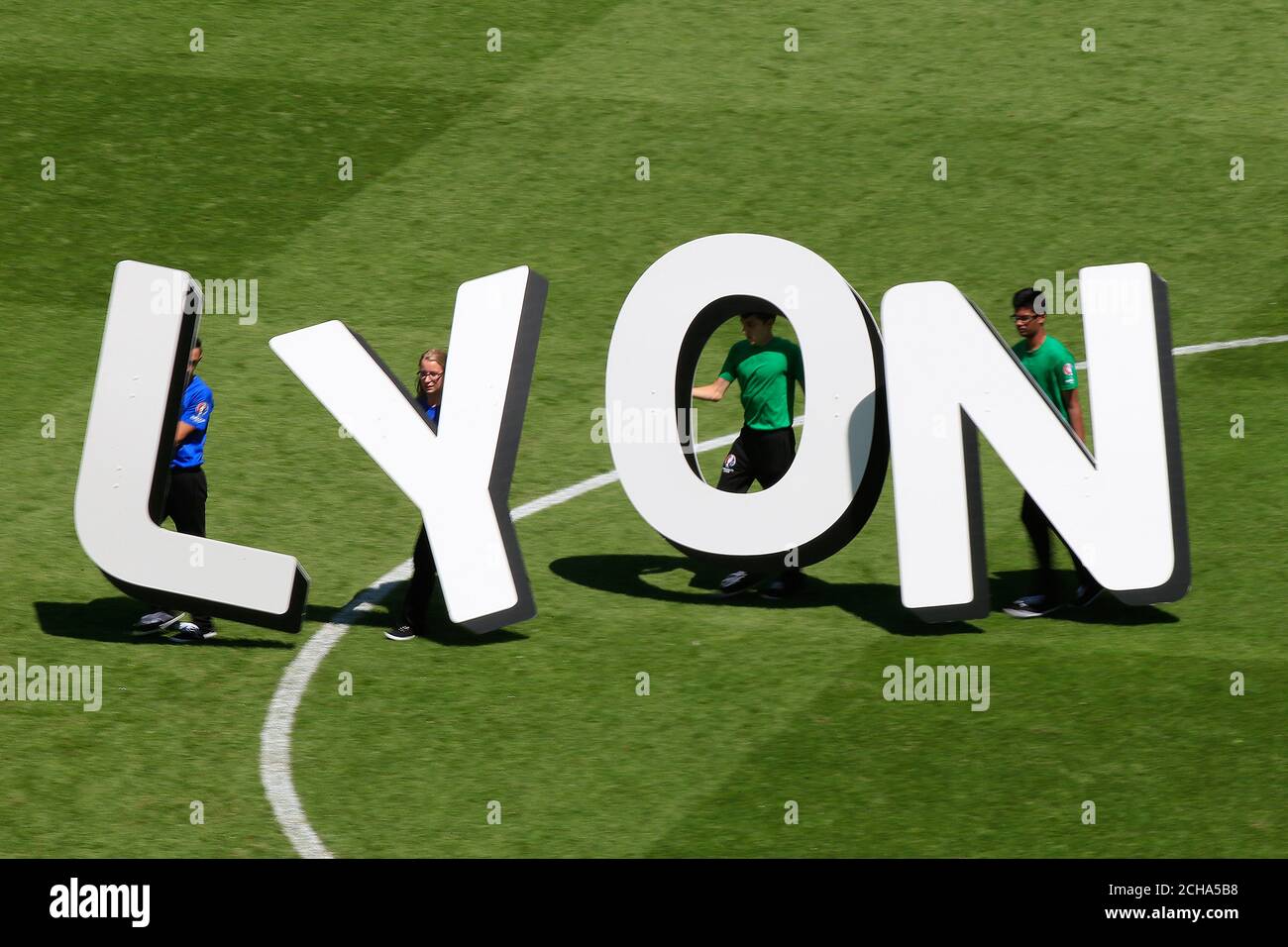 Euro 2016 Mascots move Lyon lettering from the pitch during the round ...