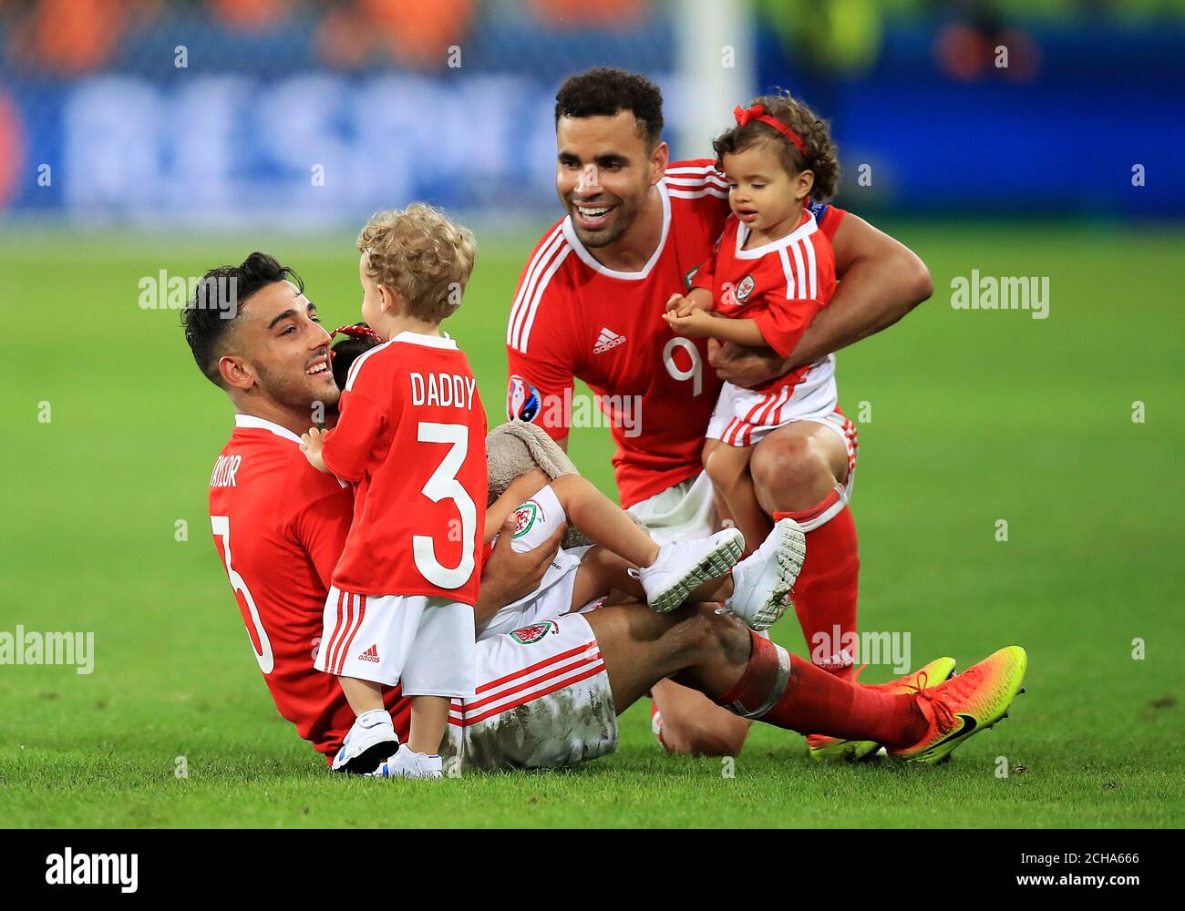 Wales' Neil Taylor (left) celebrates with Hal Robson-Kanu and children ...
