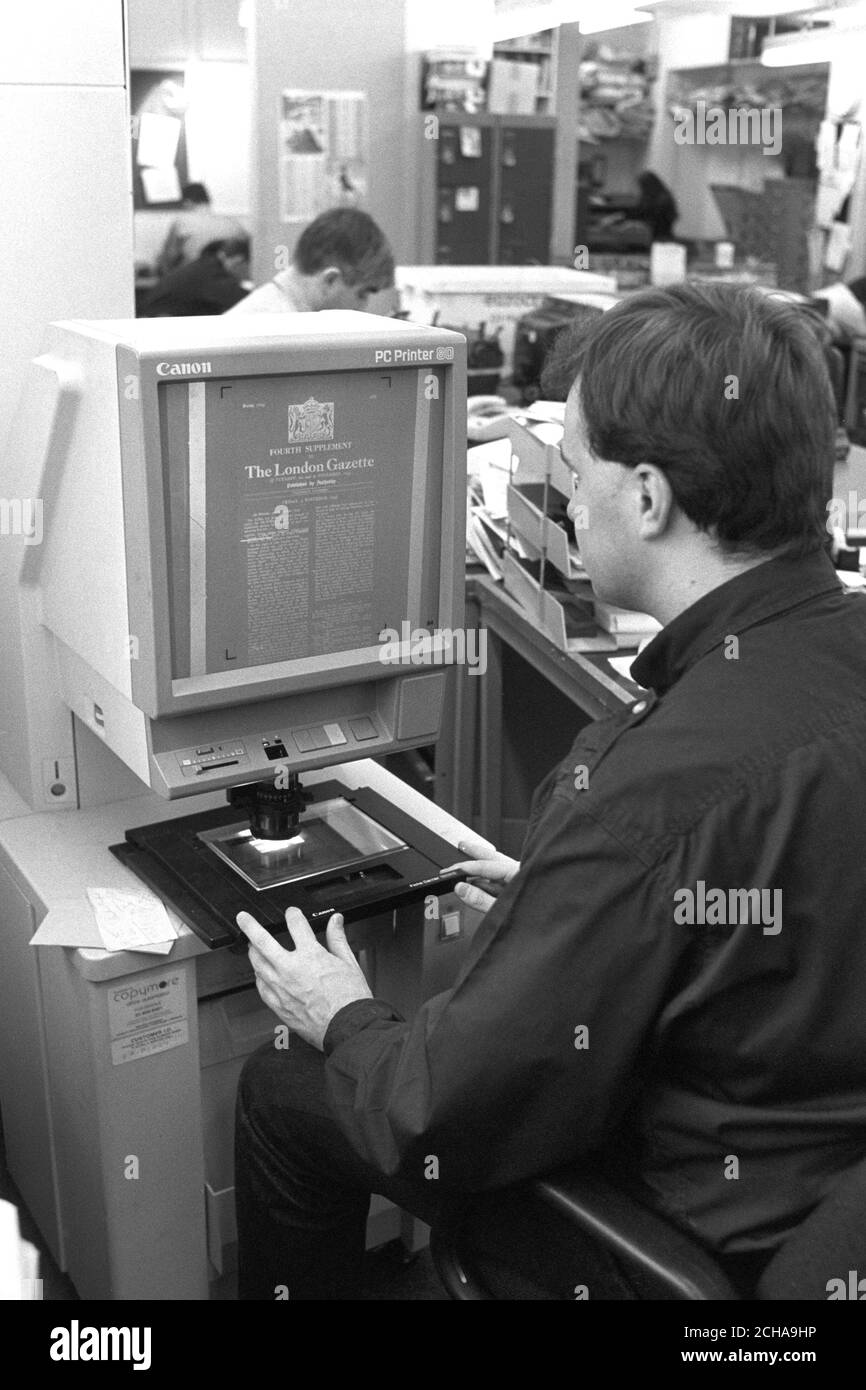 Stuart Dempsey, Head of Libraries, operates a microfiche machine in the ...
