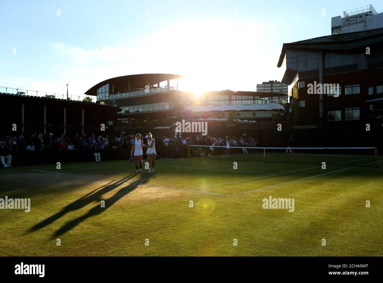 Ioana Minca and Malene Helgo play their girls doubles match on court ...