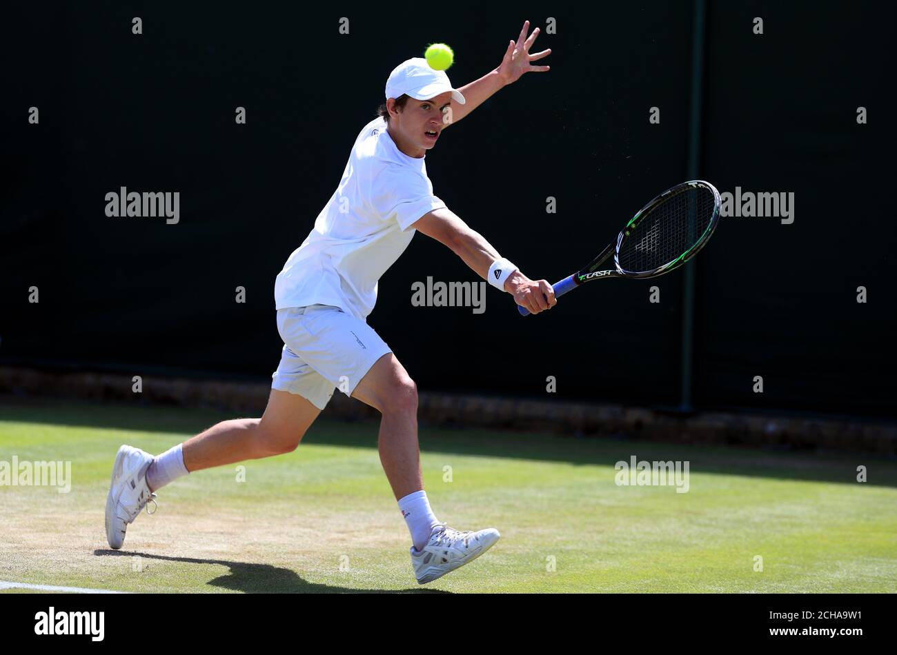 Evan Furness in action in the boys singles on day nine of the Wimbledon ...