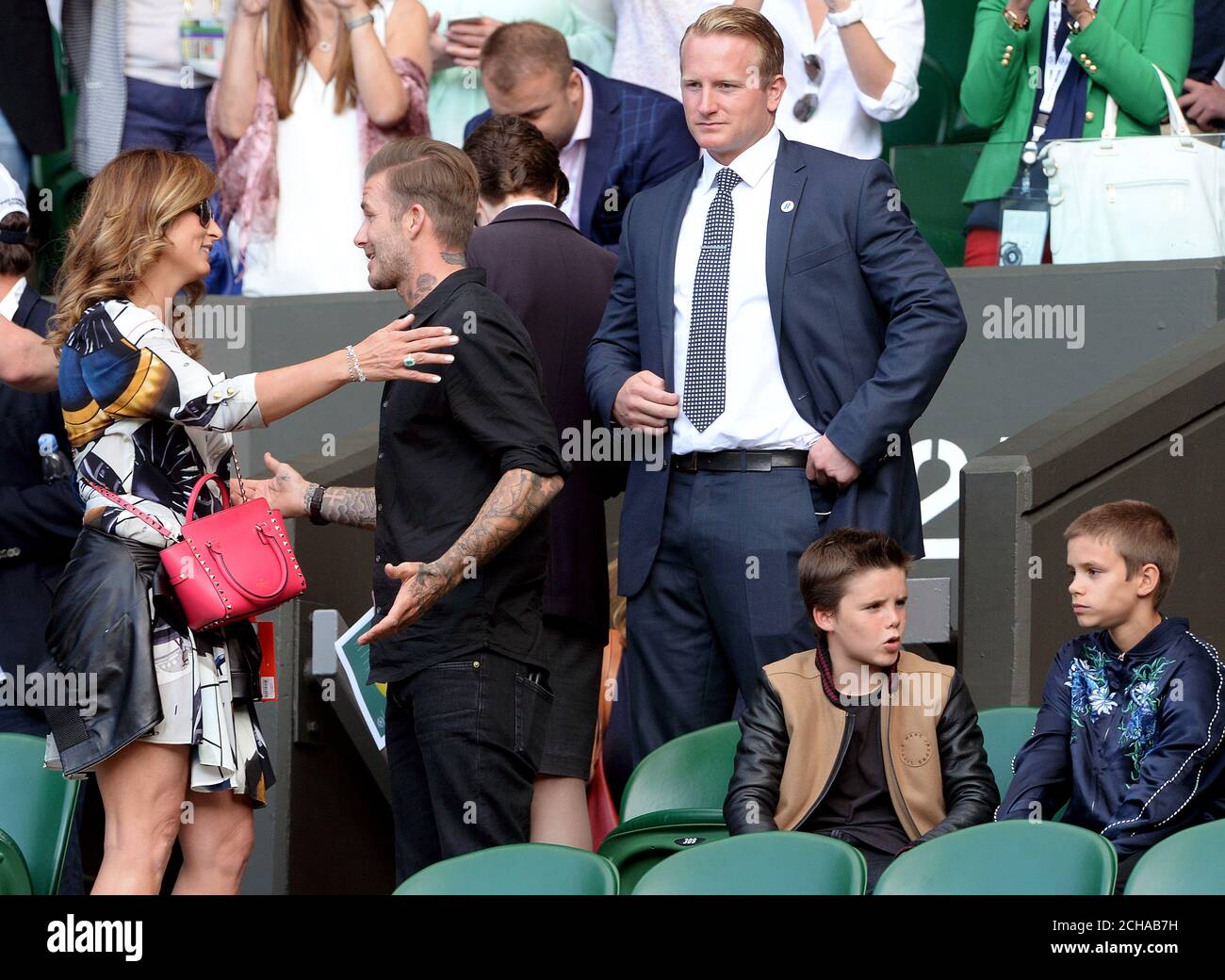 Mirka Federer speaks with David Beckham on day nine of the Wimbledon ...