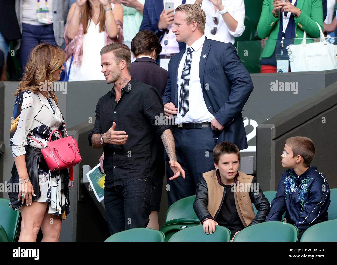 Mirka Federer speaks with David Beckham on day nine of the Wimbledon ...