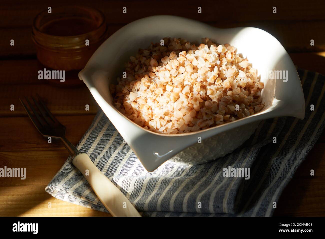 Boiled buckwheat porridge with butter served in a plate Stock Photo - Alamy