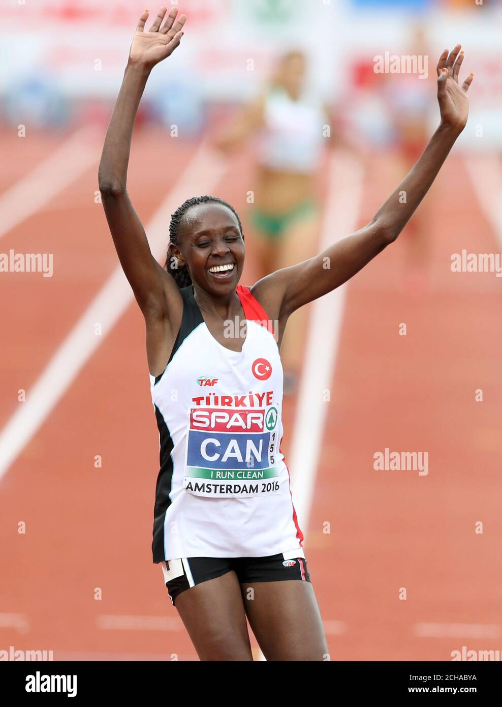 Turkey's Yasemin Can celebrates as she crosses the line to win the ...