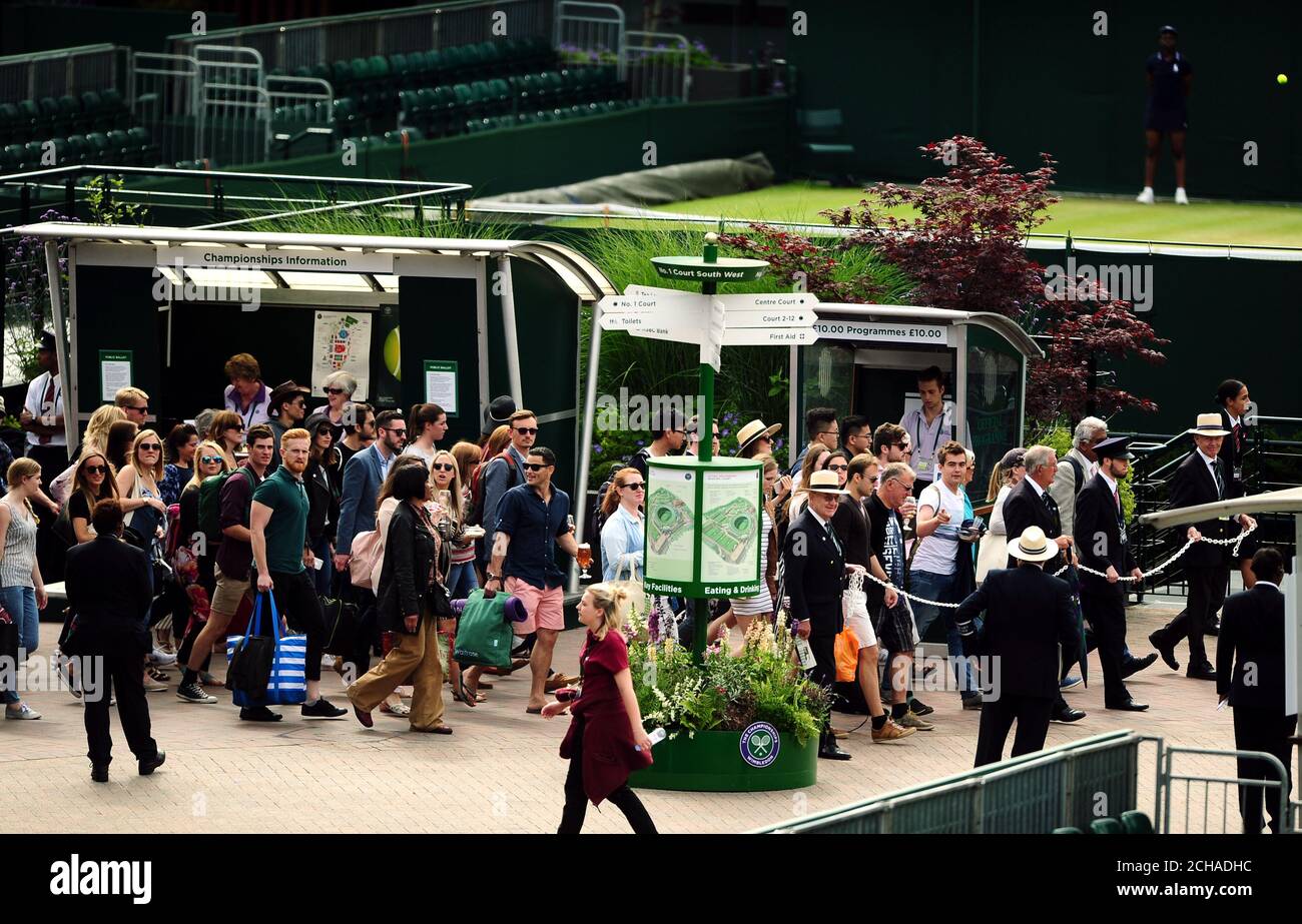 Spectators are led into the grounds by stewards at the start of day ten ...
