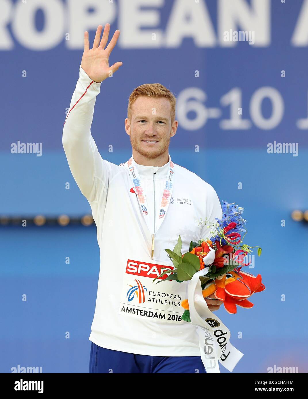 Great Britian's Greg Rutherford on the podium with his gold medal after ...