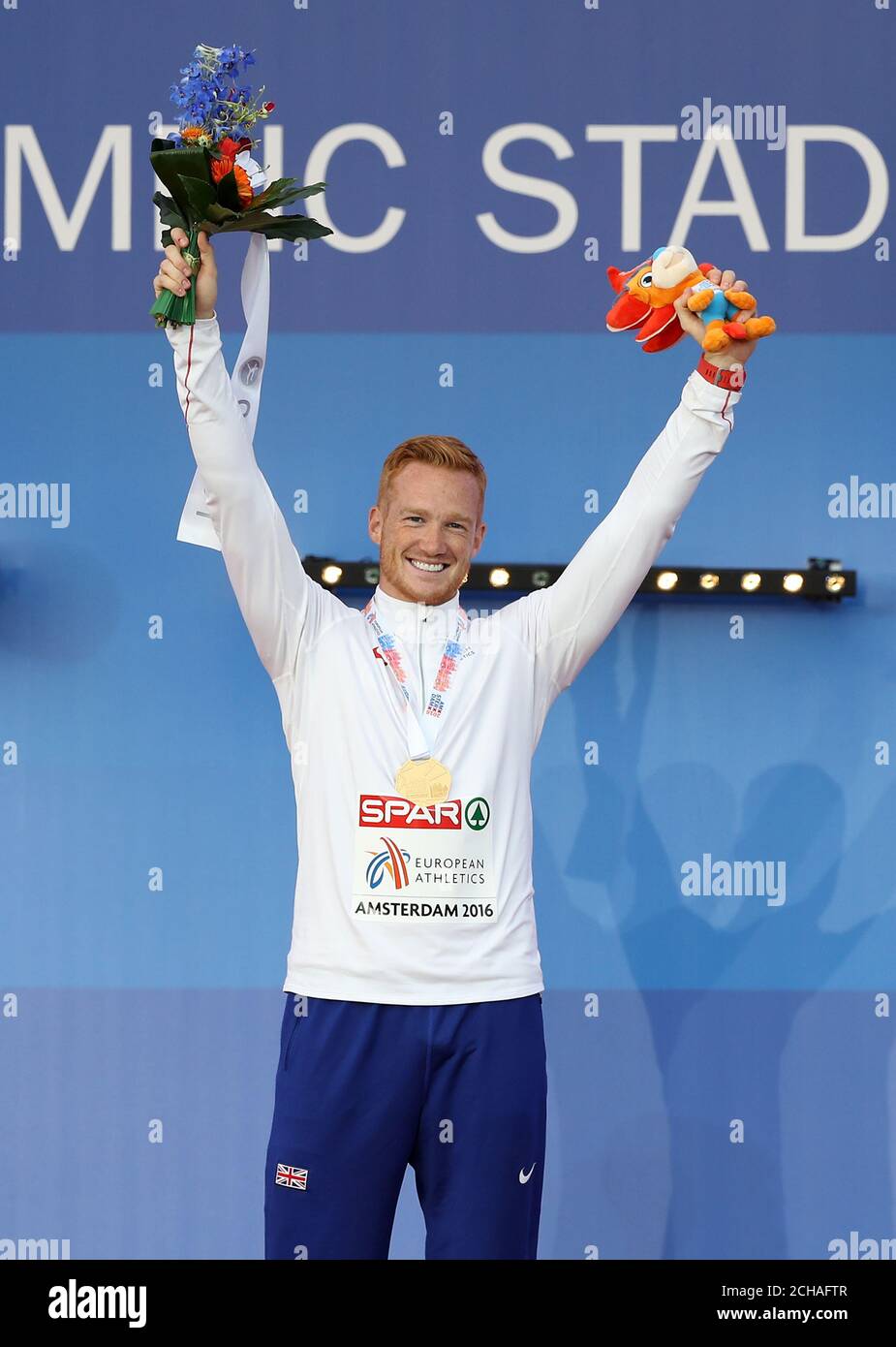 Great Britian's Greg Rutherford on the podium with his gold medal after ...