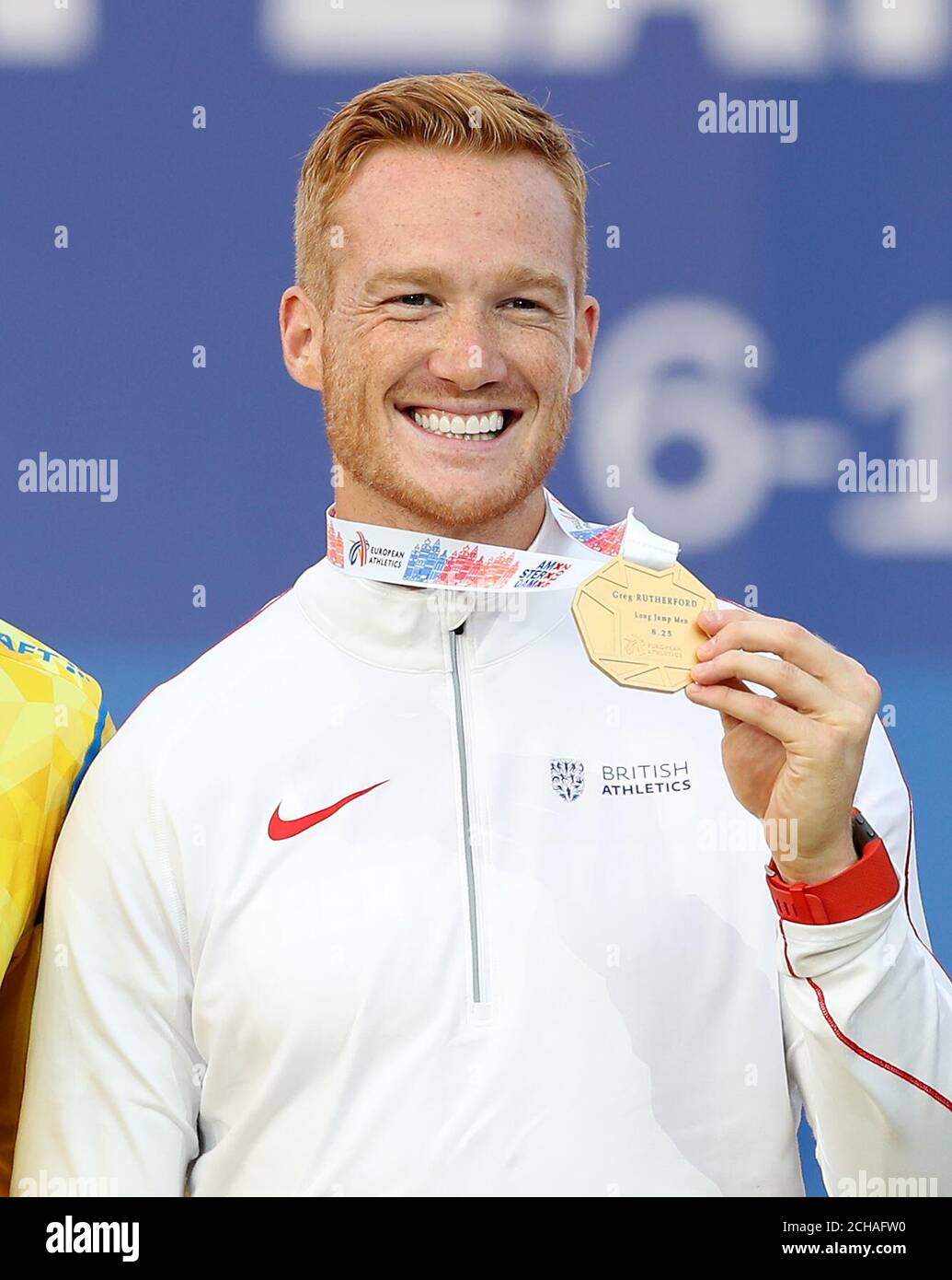 Great Britian's Greg Rutherford on the podium with his gold medal after ...