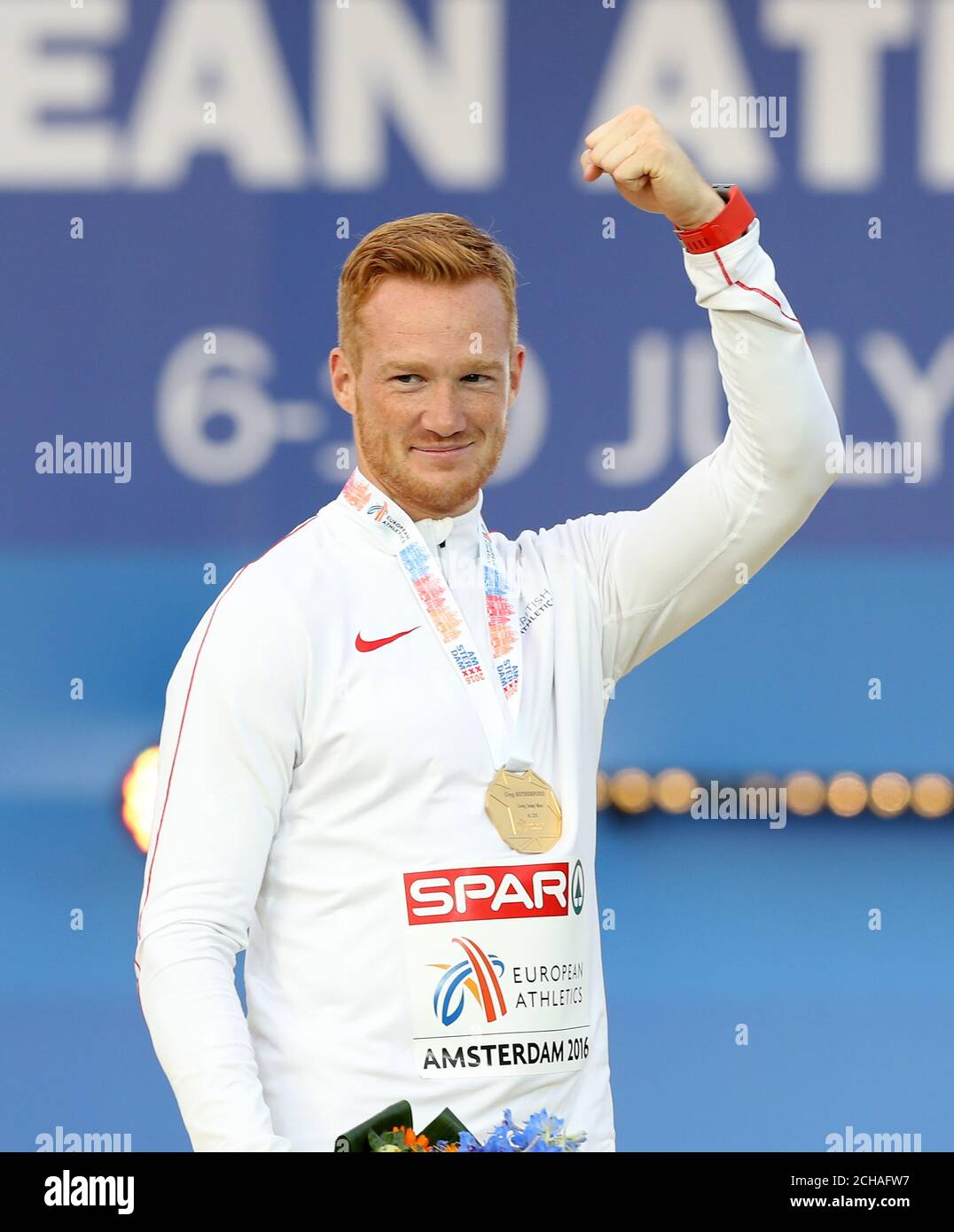 Great Britian's Greg Rutherford on the podium with his gold medal after ...