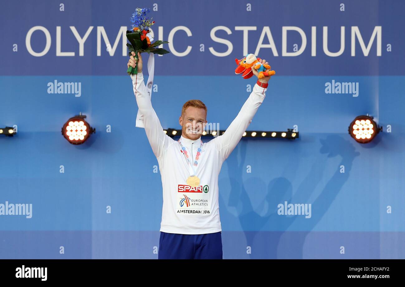 Great Britian's Greg Rutherford on the podium with his gold medal after ...