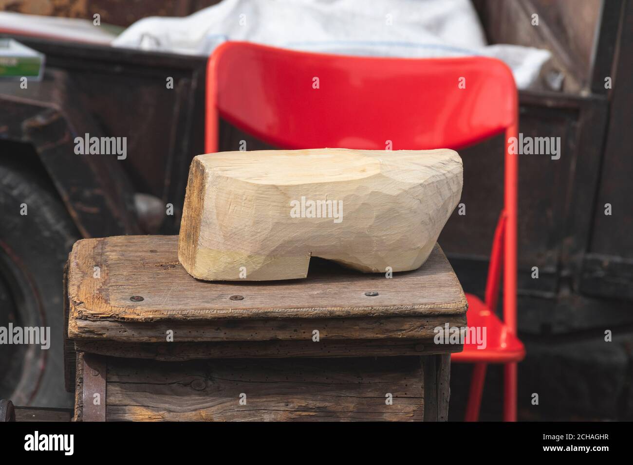 A block of wood from which the clog maker chisels a wooden shoe Stock ...