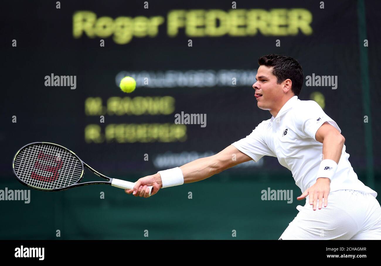 Milos Raonic in action against Roger Federer on day eleven of the ...