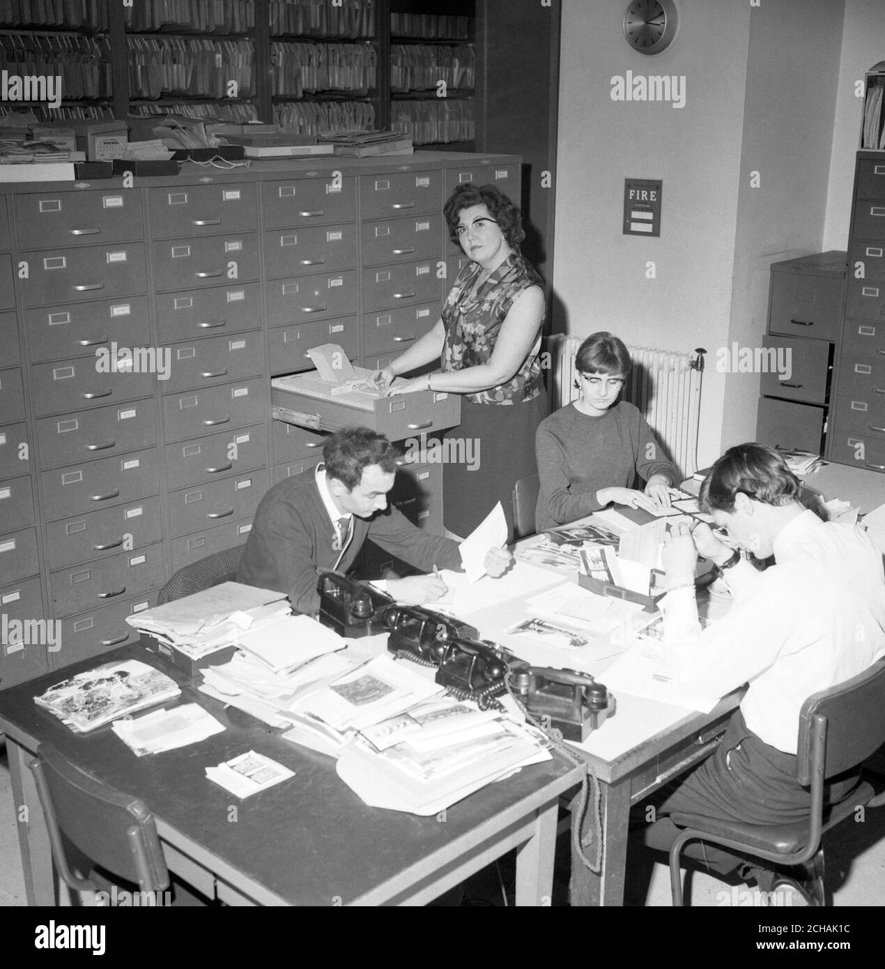 Staff at work in the Press Association photo library Stock Photo - Alamy