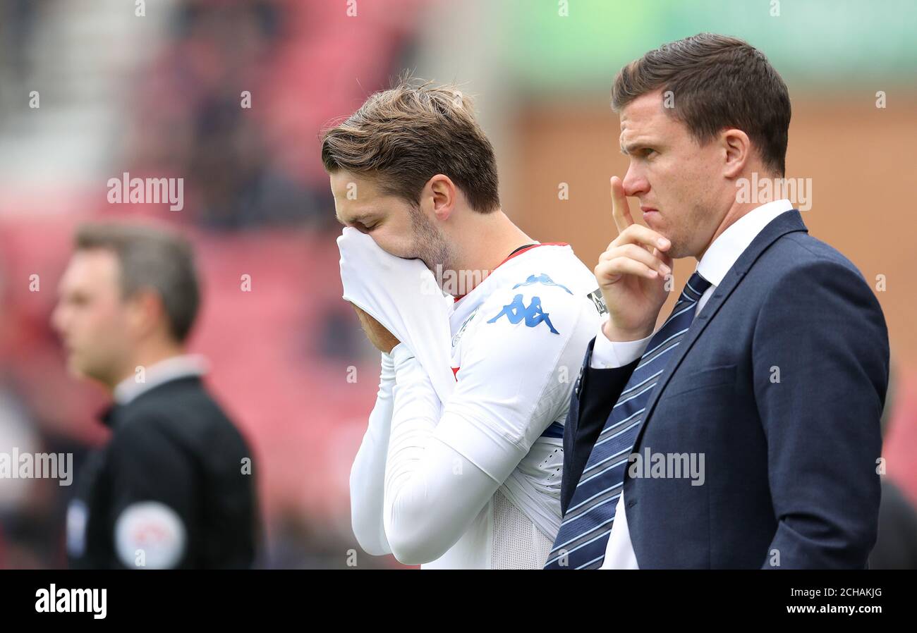 Manchester United's Nick Powell (left) with manager Steven Caldwell ...