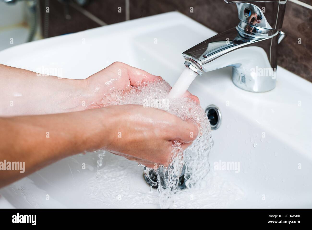 Washing hands under the water tap or faucet without soap. Hygiene ...