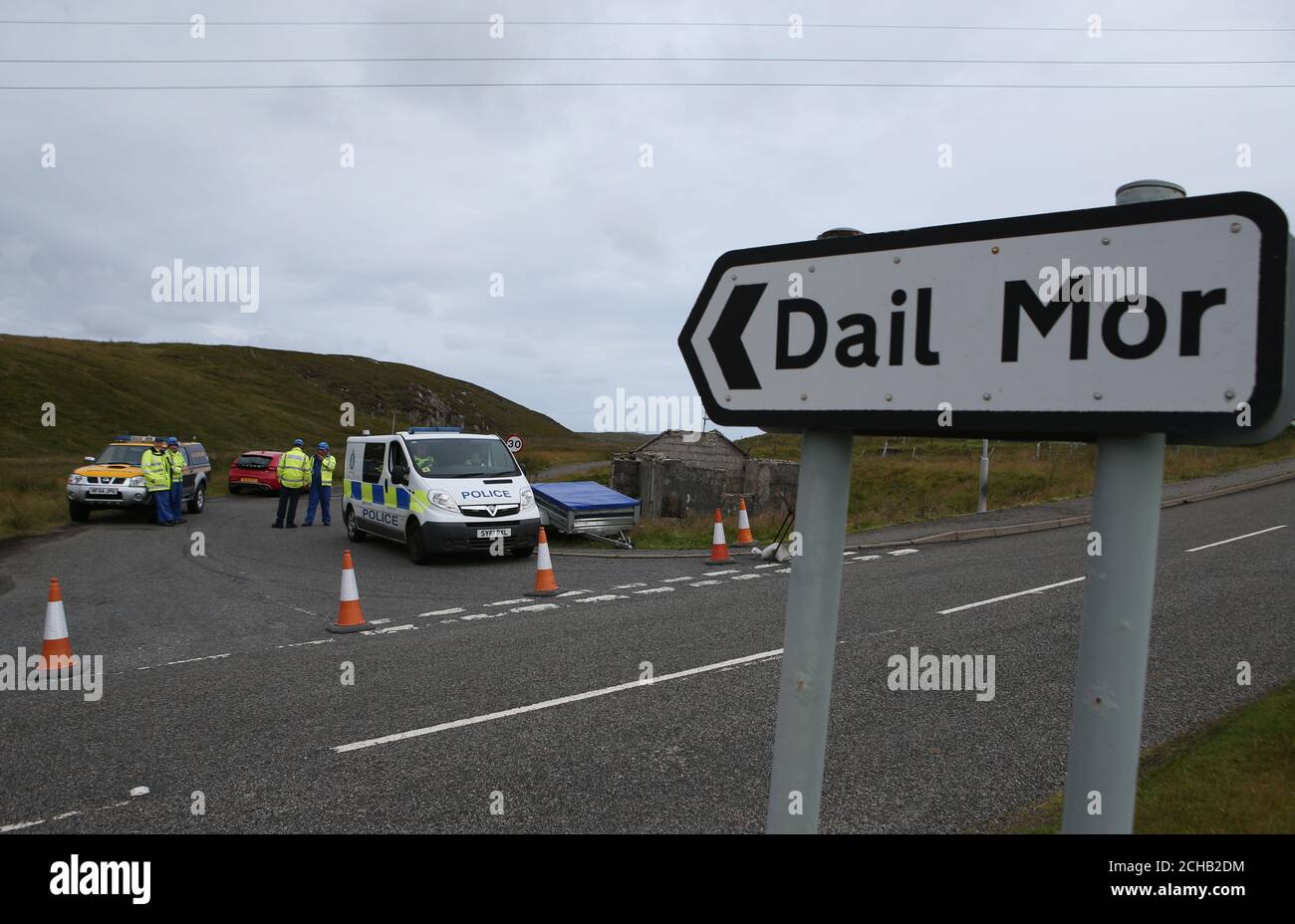 Police and Coast guard at a road block at the entrance to Dalmore Beach ...