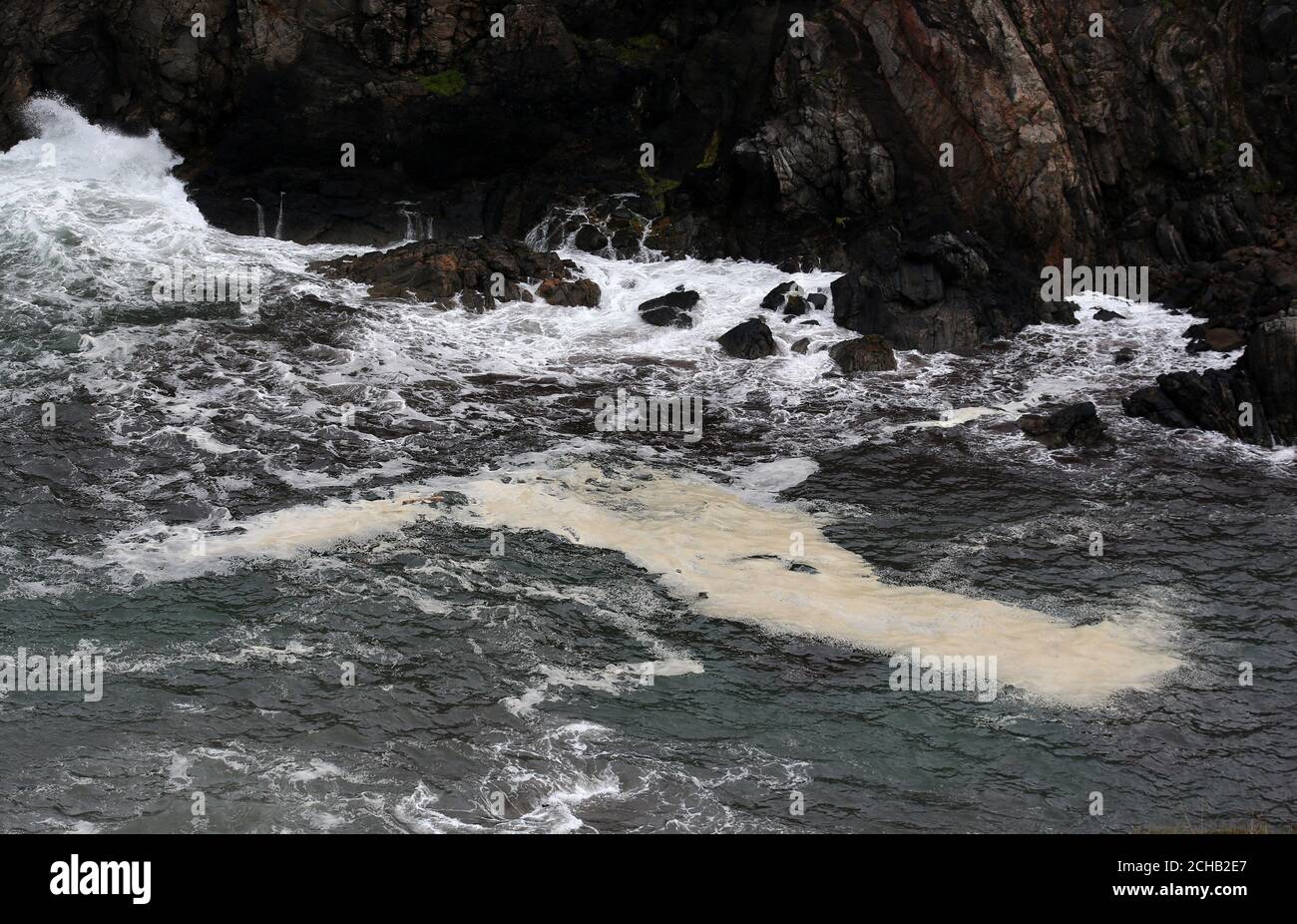 Dark coloured water near the 17000-tonne drilling rig Transocean Winner ...