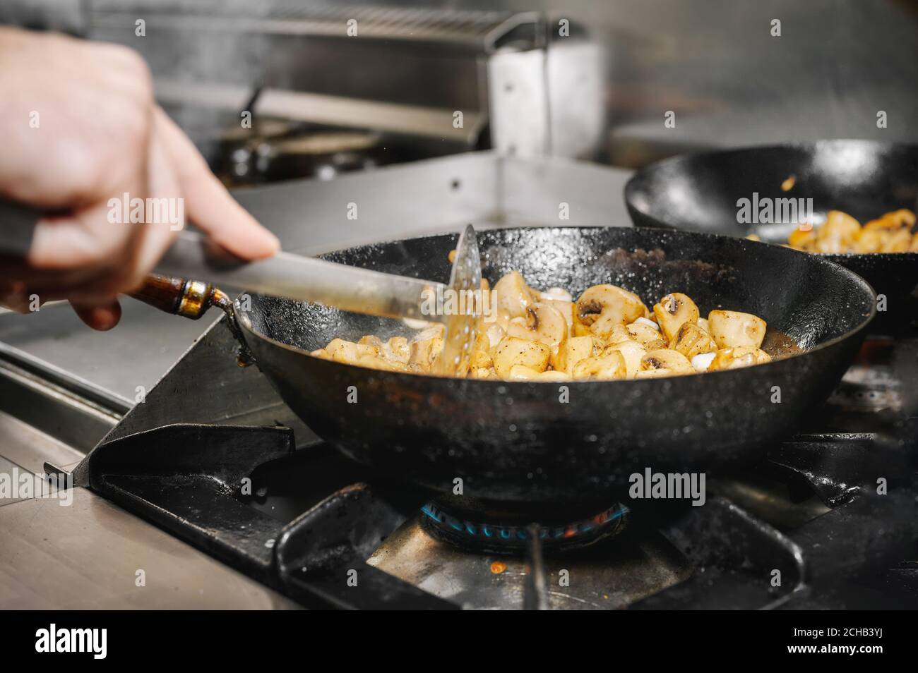 Person frying vegetables cooking hi-res stock photography and images ...