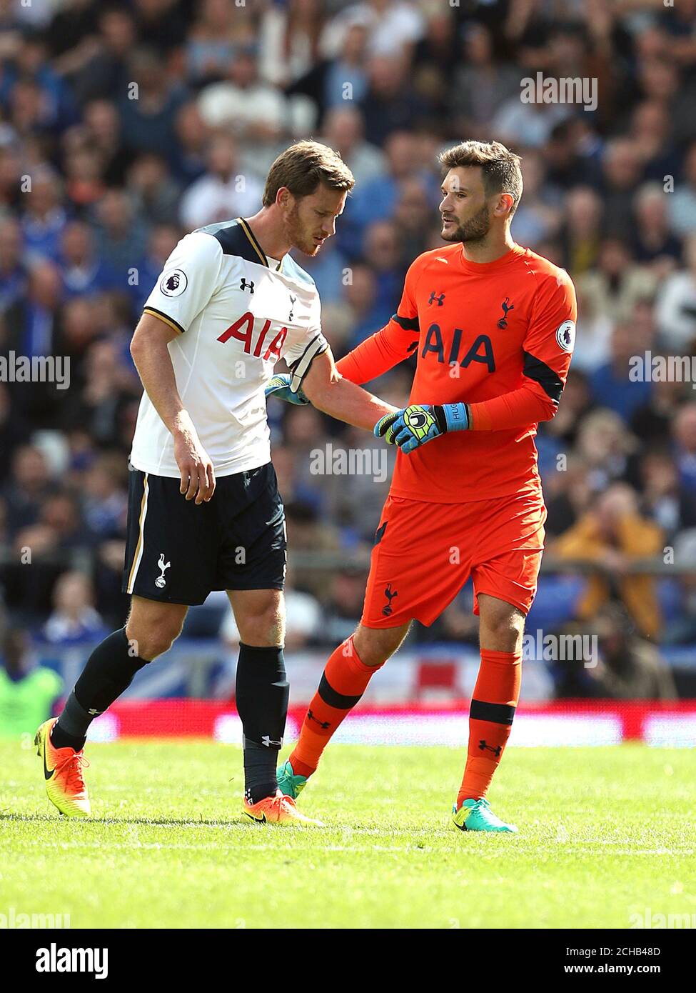 Tottenham Hotspur goalkeeper Hugo Lloris (right) hands over the ...