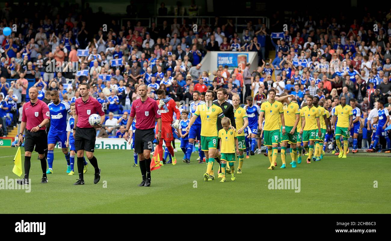 The two teams walk out before kick-off Stock Photo - Alamy