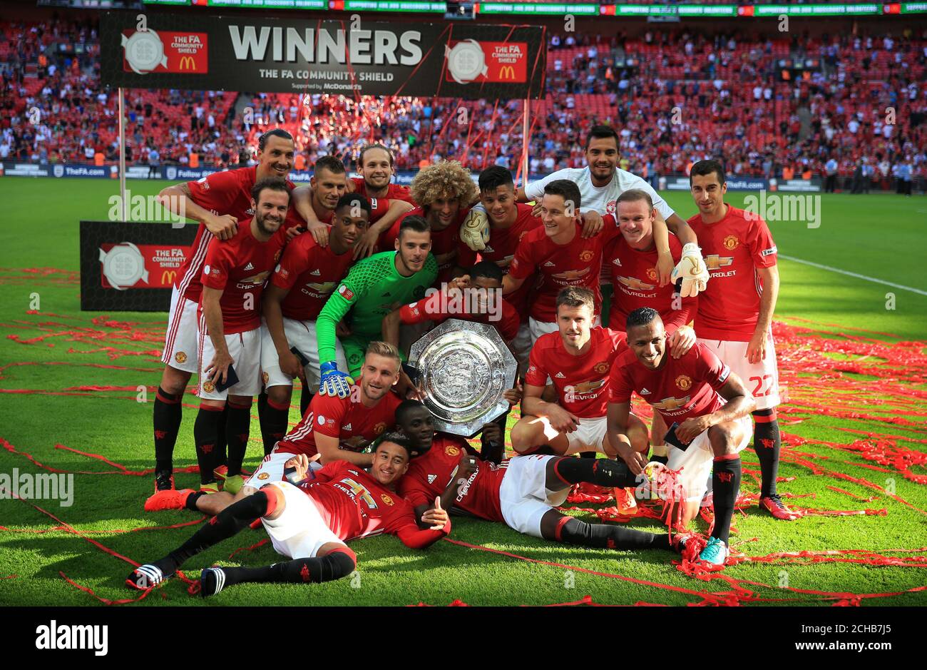 Manchester United players pose with The FA Community Shield trophy ...