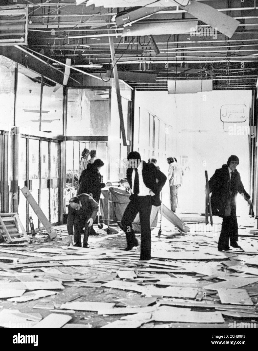 Detectives sifting through the rubble after the explosion at British ...