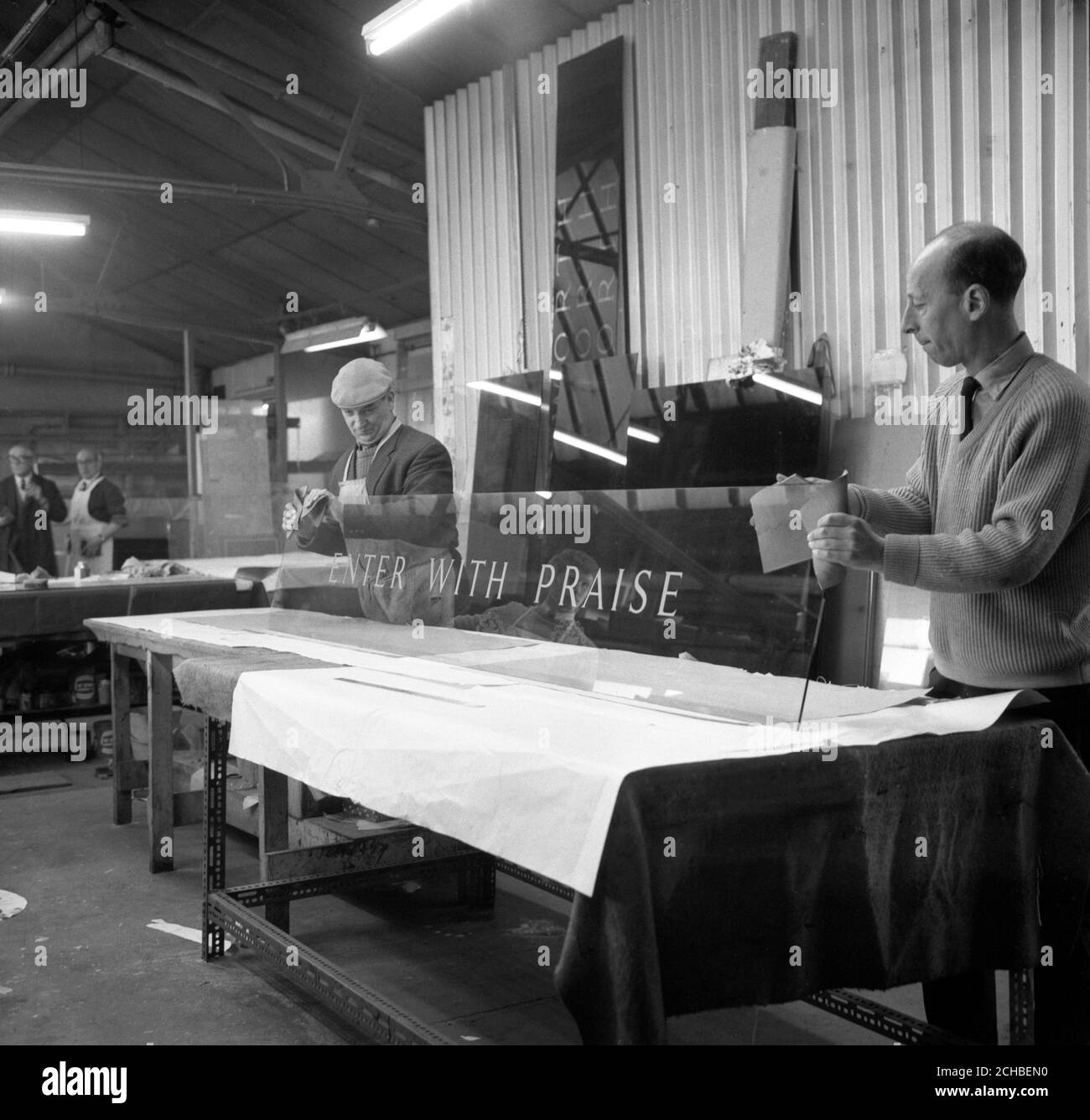 Workmen, of Messrs T&W Ide Ltd in London, with engraved glass to go ...