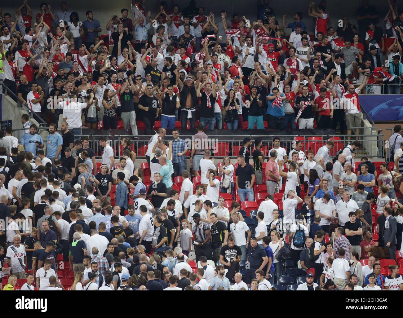 AS Monaco fans (top) celebrate as Tottenham Hotspur fans head for the ...