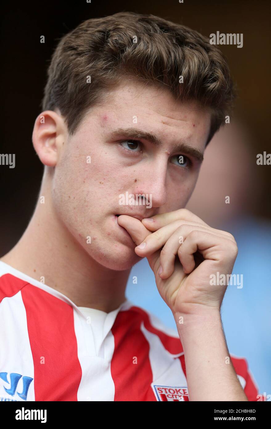 A Stoke City fan looks nervous in the stands Stock Photo - Alamy