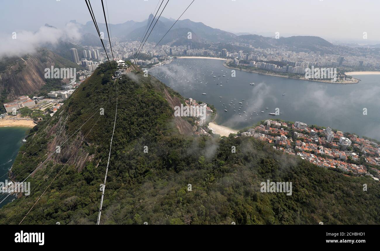 A cable car makes it's way up to the top of Sugarloaf mountain from ...