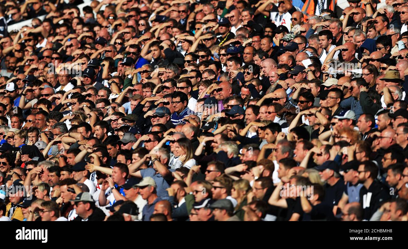 Tottenham Hotspur fans shield their eyes from the sun at White Hart ...