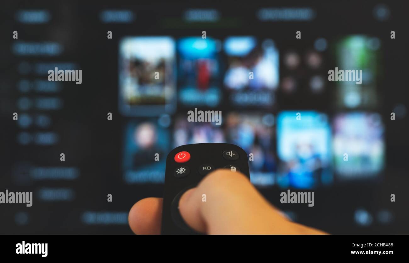 Male hand with remote control pointing on Smart TV Stock Photo - Alamy