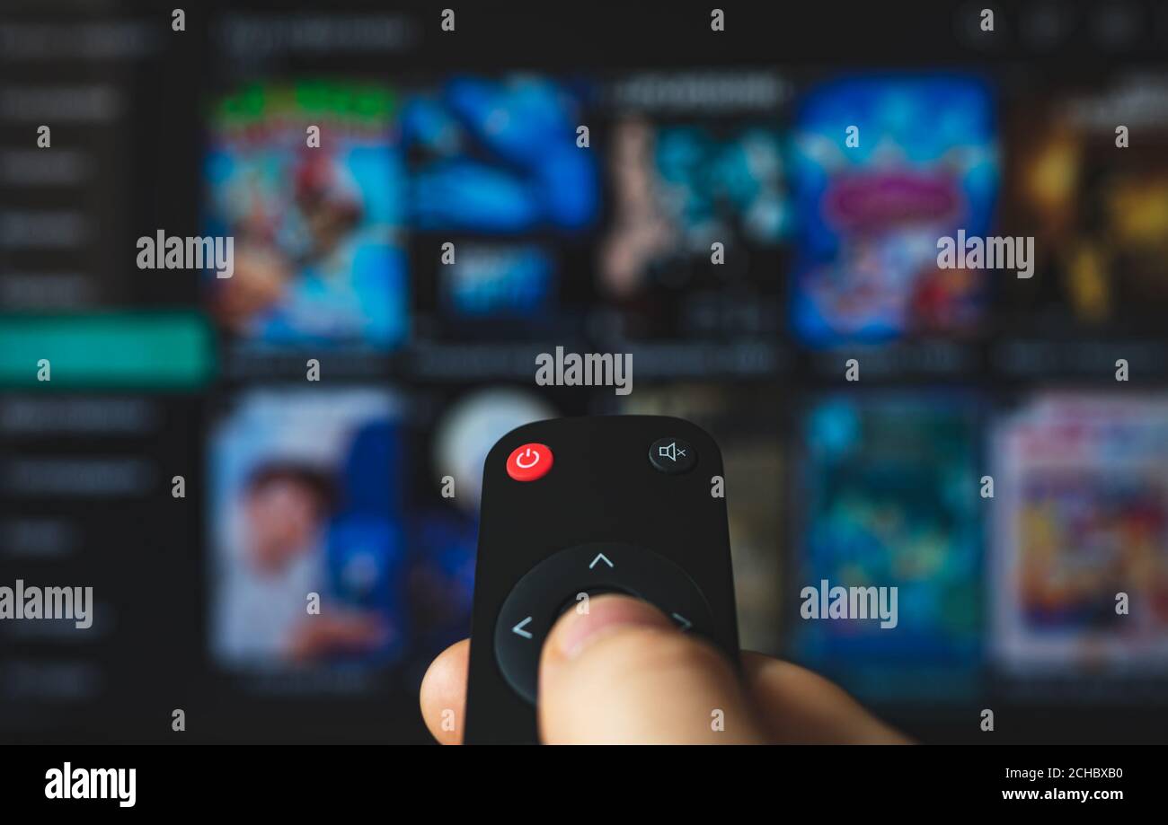 Male hand with remote control pointing on Smart TV Stock Photo - Alamy