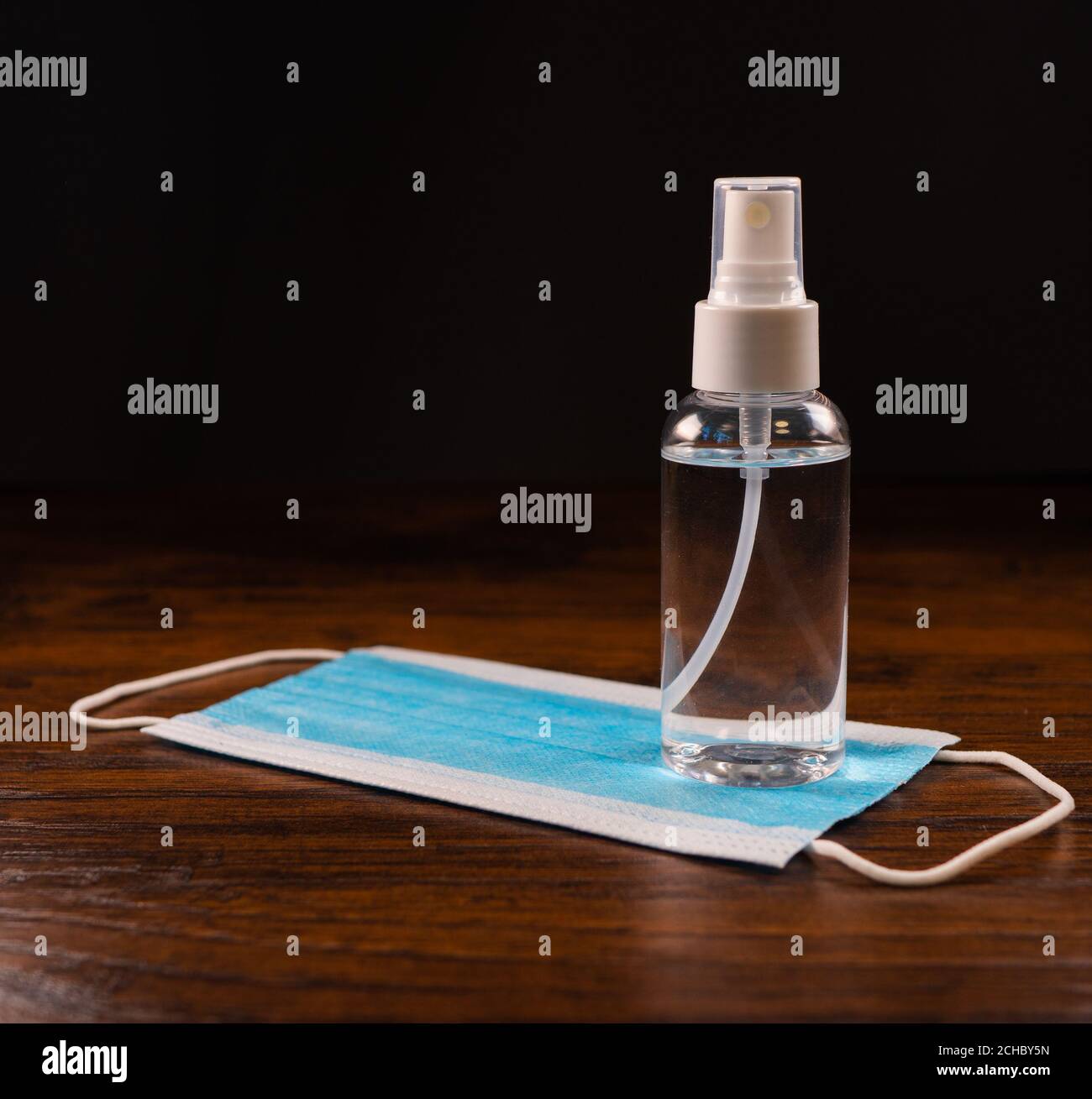 Covid-19 Disinfectant spray and face mask Stock Photo - Alamy