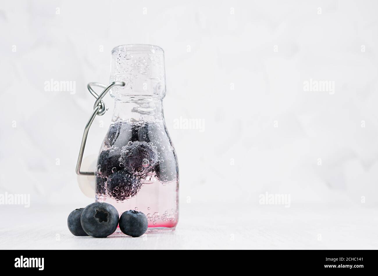 Summer homemade pink drink - infused blueberry water with berry, soda ...