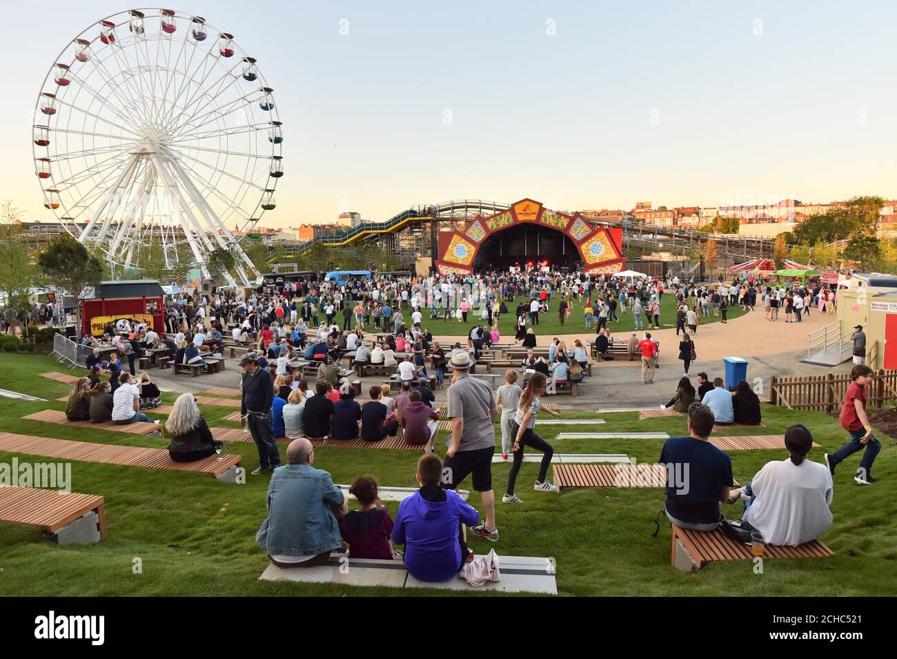 Visitors watch Vintage Trouble performing during the re-opening of ...