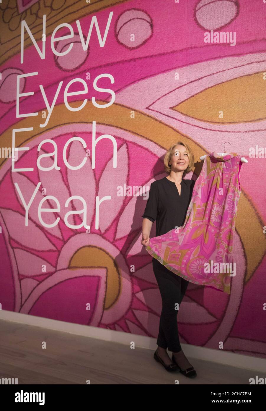 EDITORIAL USE ONLY Curator Anna Farthing with a dress that belonged to ...