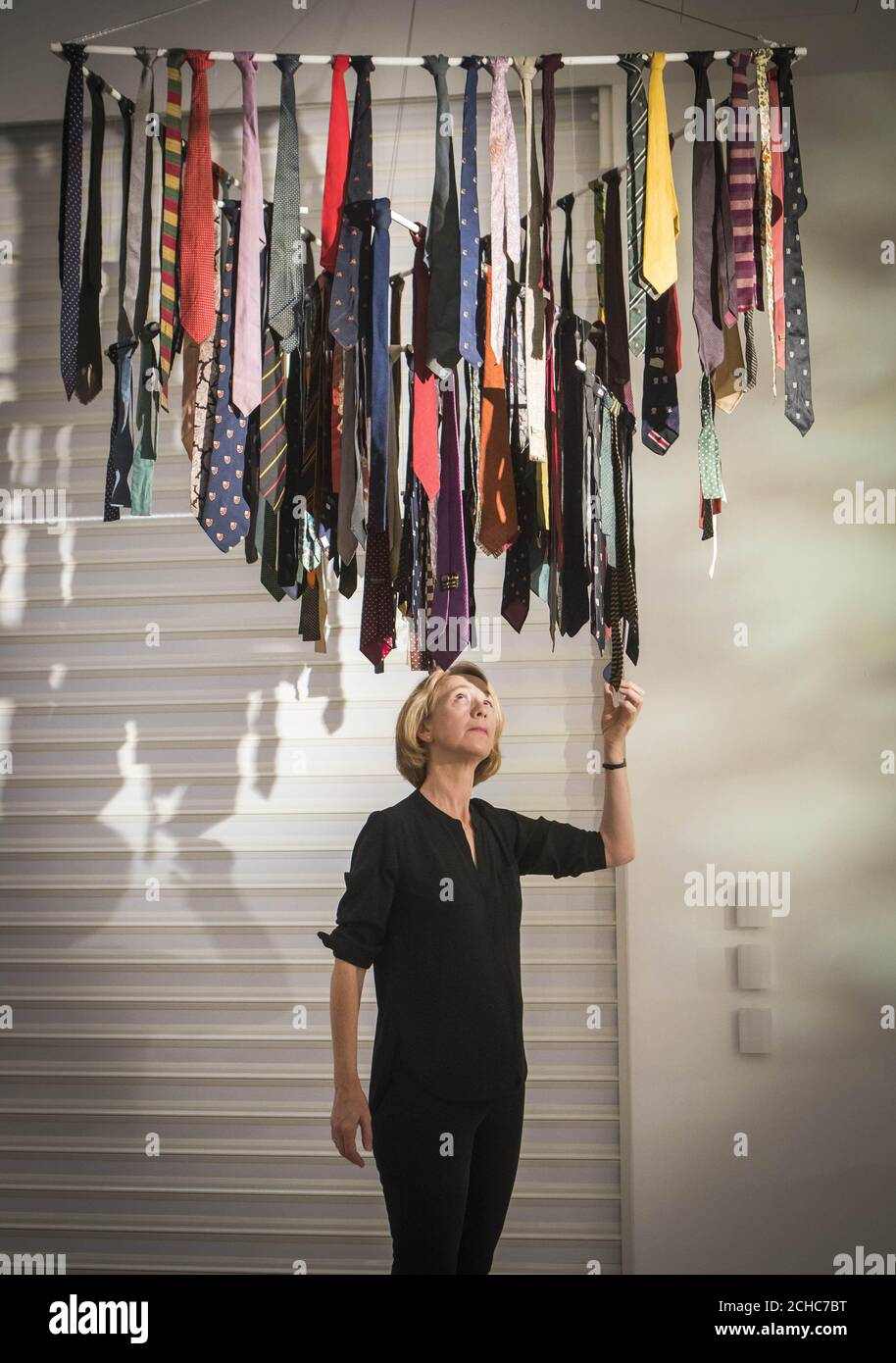 EDITORIAL USE ONLY Curator Anna Farthing with 119 ties that belonged to ...