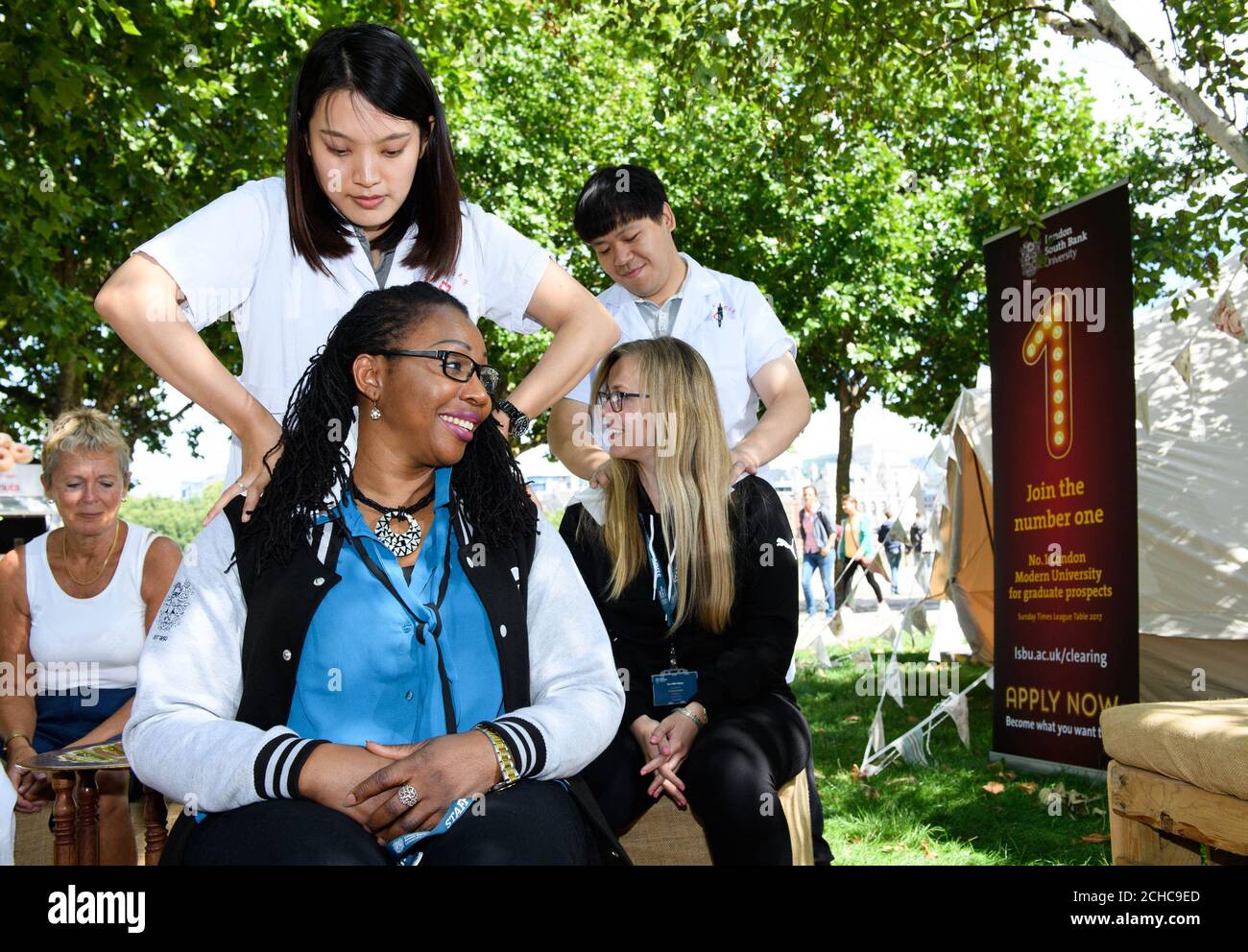 Patricia Goodwin (left) and Chloe de Boer (right) receives massages at ...