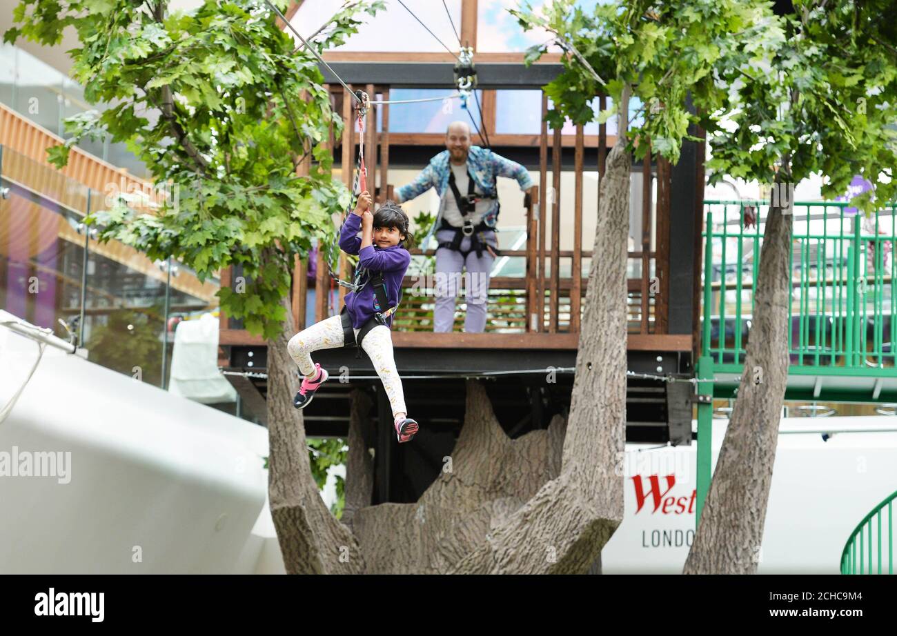 EDITORIAL USE ONLY Nicholas Llewellyn watches as Rhya Srinivas, 6, from ...