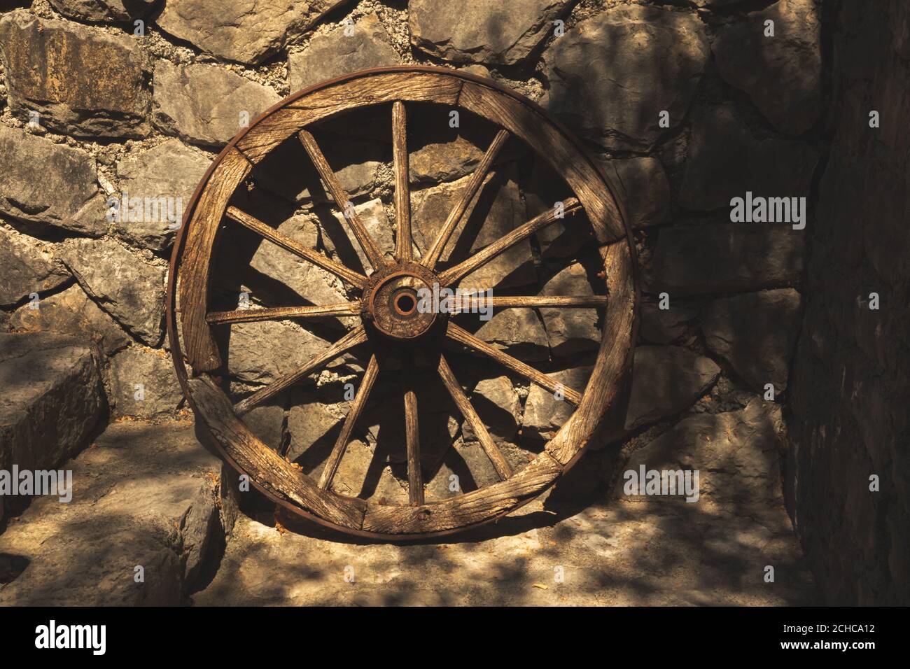 Old vintage cart wheel on an entourage background travel Stock Photo ...